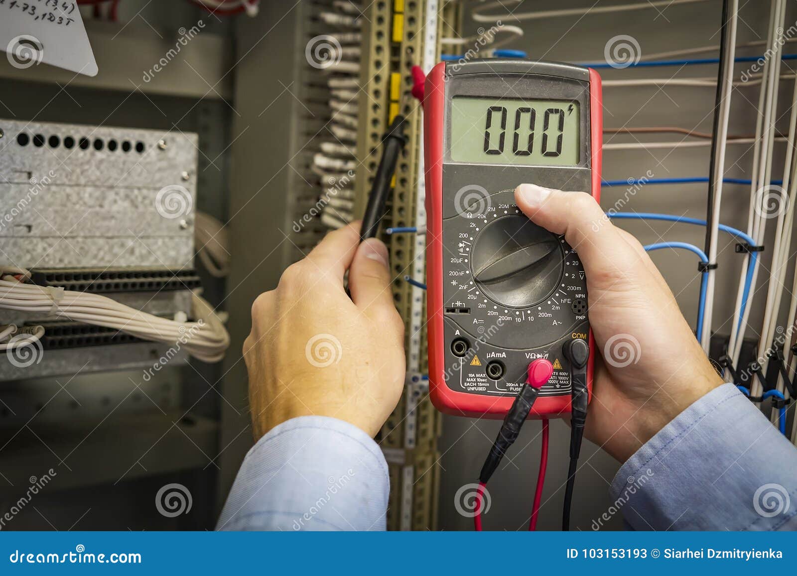 Multimeter in Hands of Electrician Engineer Closeup on Electric Panel ...