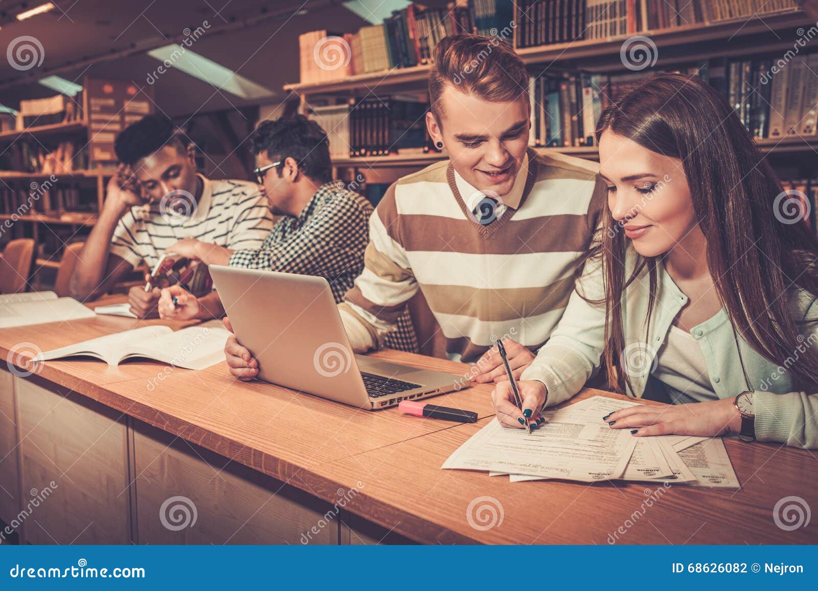 Multinational Group of Cheerful Students Studying in the University ...