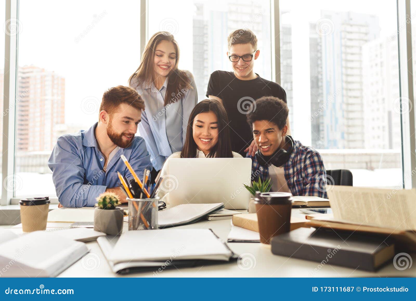 Multinational Happy Students Gathering in Library, Using Laptop Stock ...
