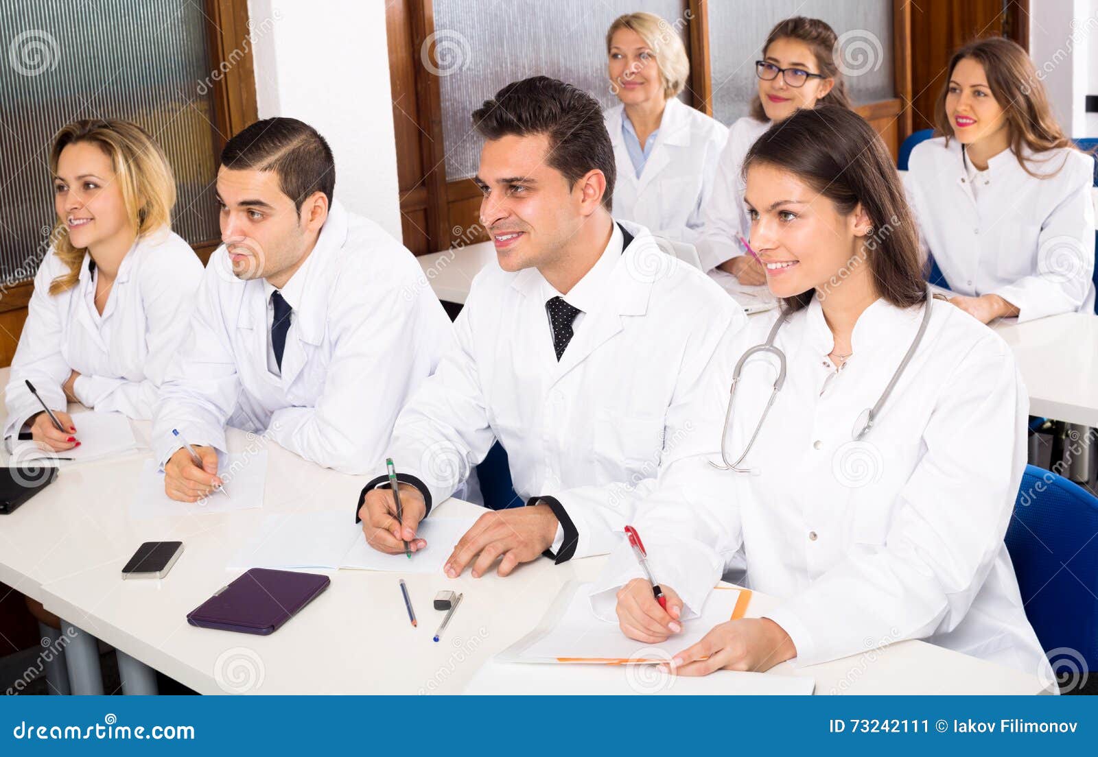 Multinational Interns and Professor Having Discussion Stock Image ...