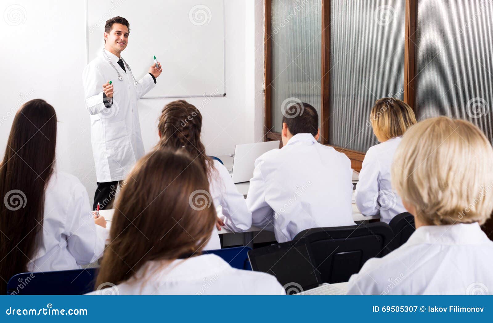 Professor Having Discussion With College Students Stock Photography ...