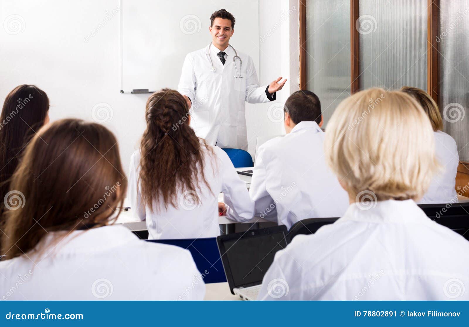 Multinational Interns and Professor Having Discussion Stock Image ...