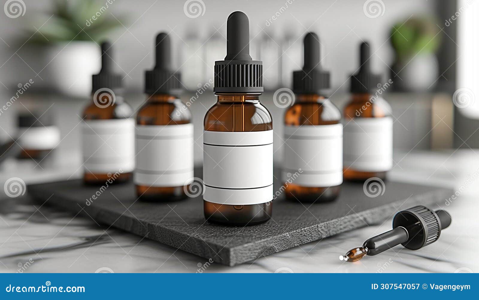 Multiple Amber Dropper Bottles with Blank White Labels on a Black Slate ...