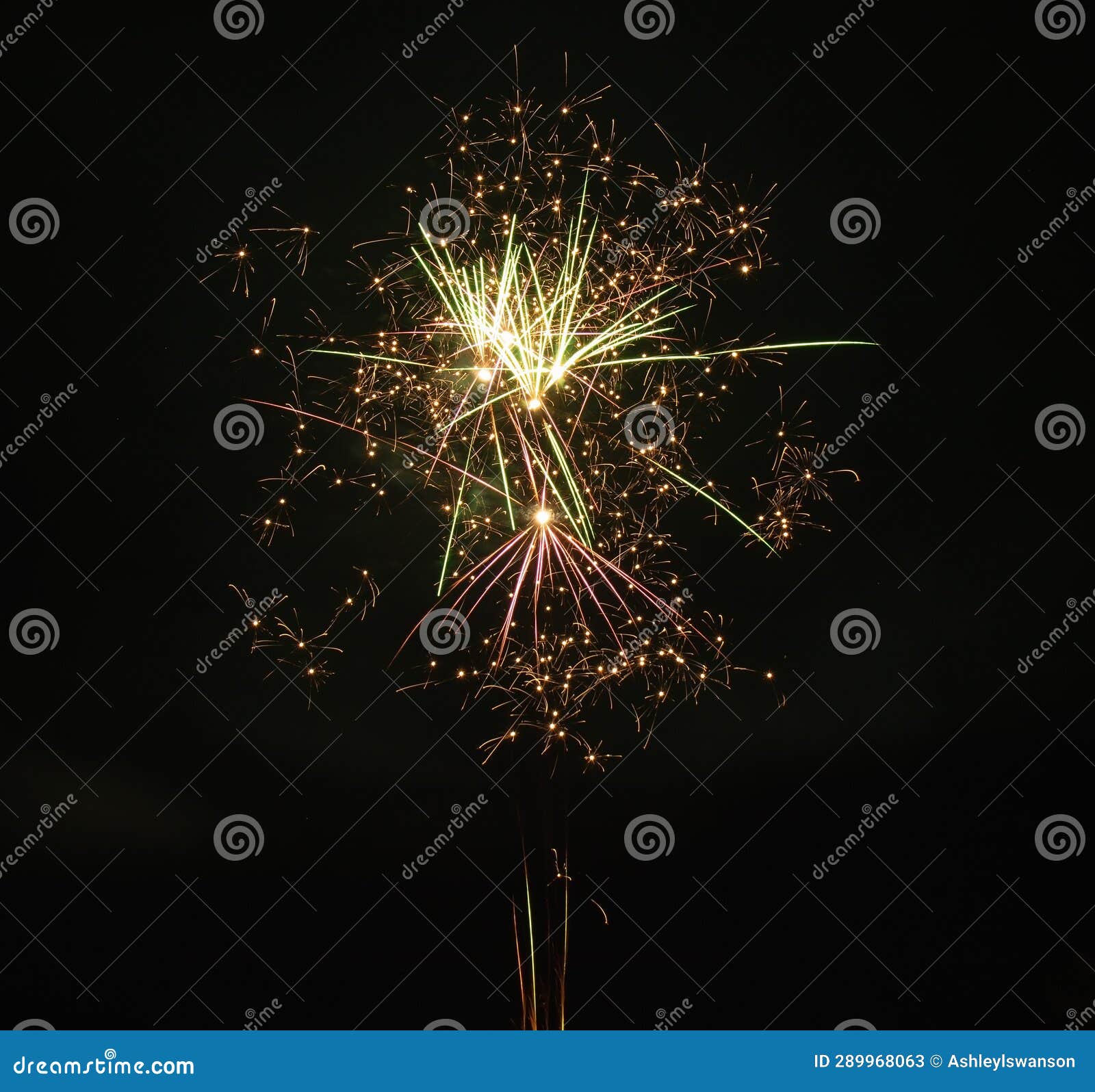 Multiple Bright Yellow Green and Pink Fireworks at Night Stock Image ...