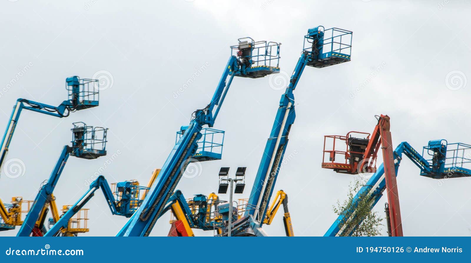 Multiple Cherry Pickers stock photo. Image of extended - 194750126