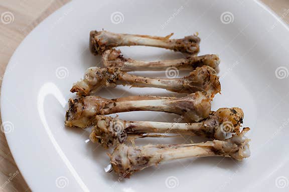 Multiple Chicken Bones on a White Plate Stock Image - Image of bones ...