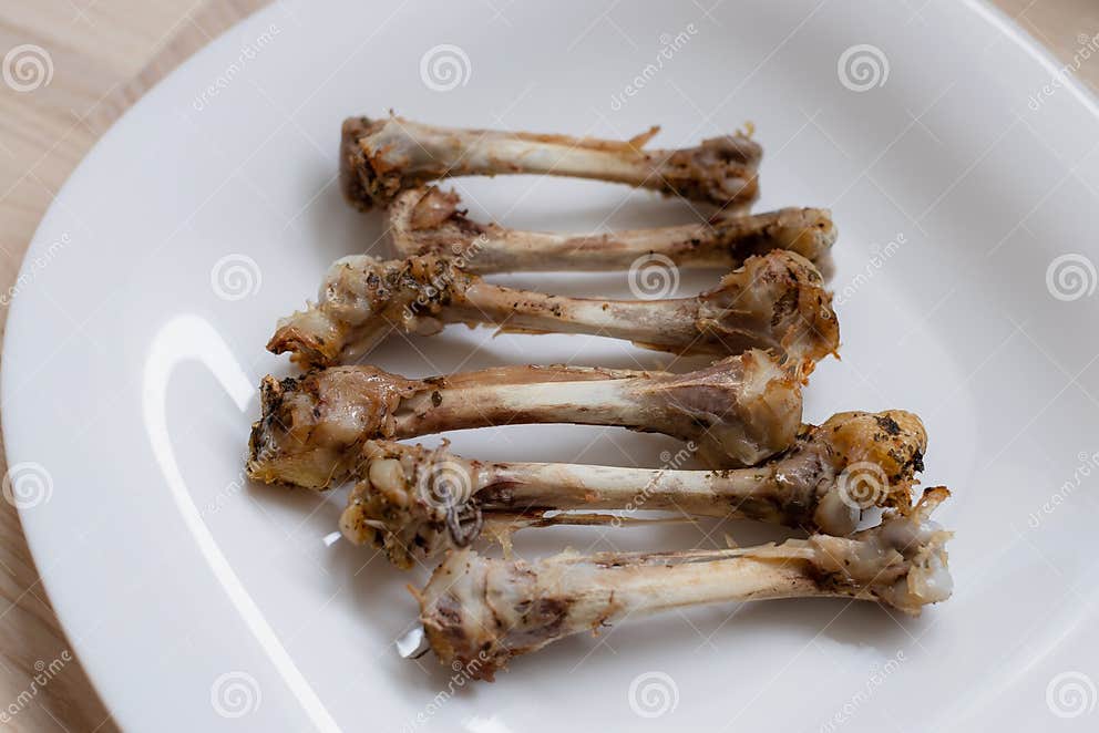 Multiple Chicken Bones on a White Plate Stock Image - Image of bones ...