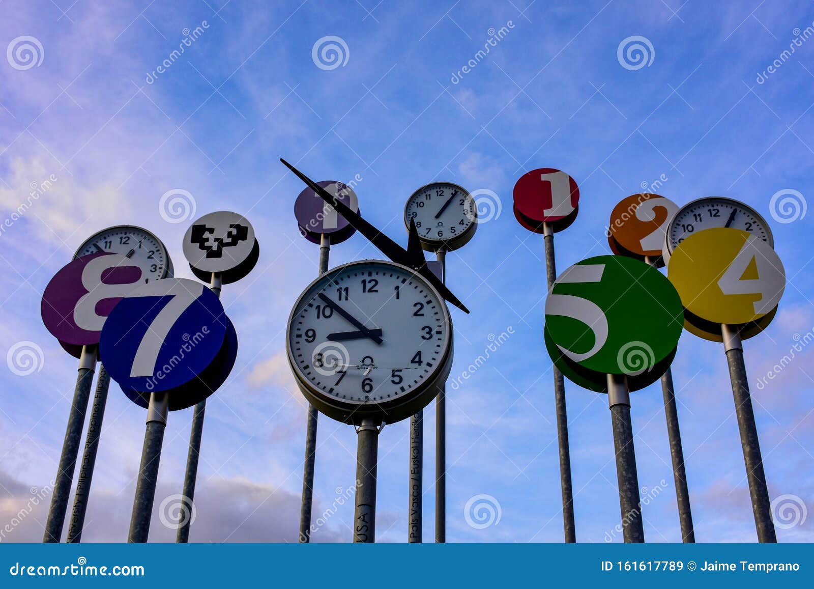 Multiple Clocks Giving Time and Calm on a Blue Sky Stock Image - Image ...