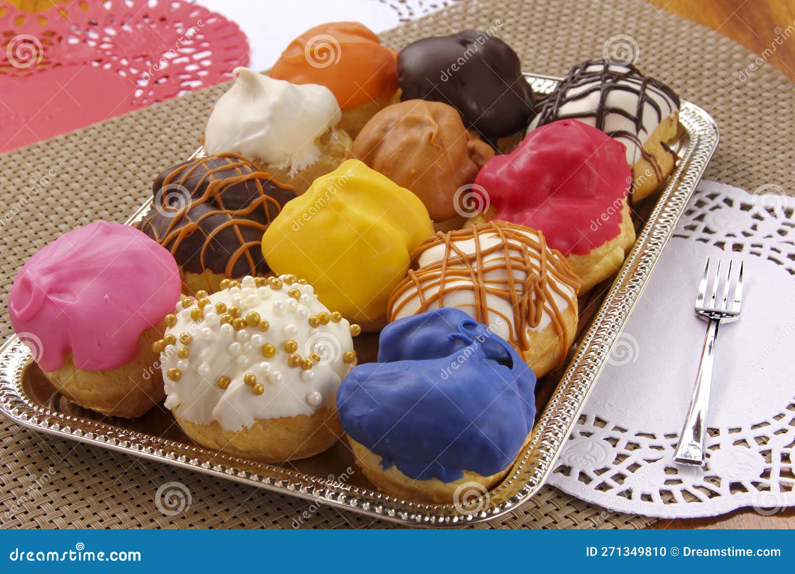 Multiple Coloured Cream Puffs Stock Photo - Image of delicious, dessert ...