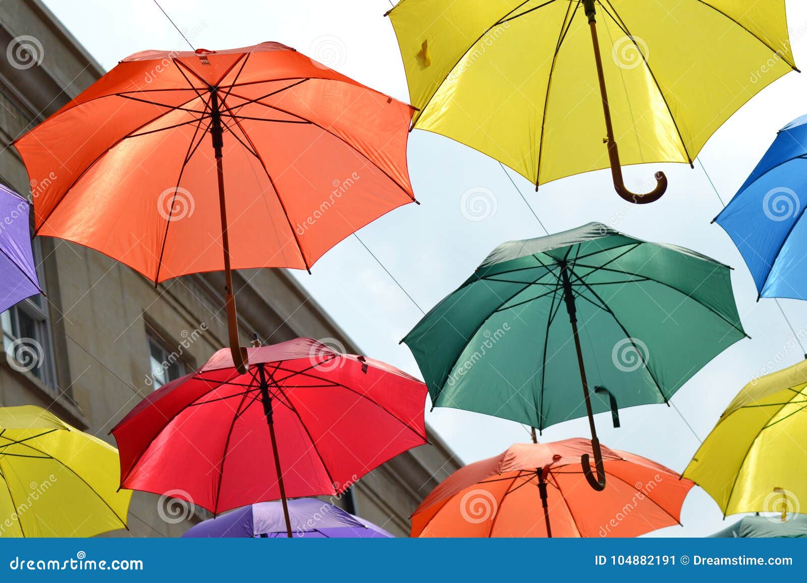 Multiple Coloured Umbrellas Hanging on Wire Stock Image - Image of ...