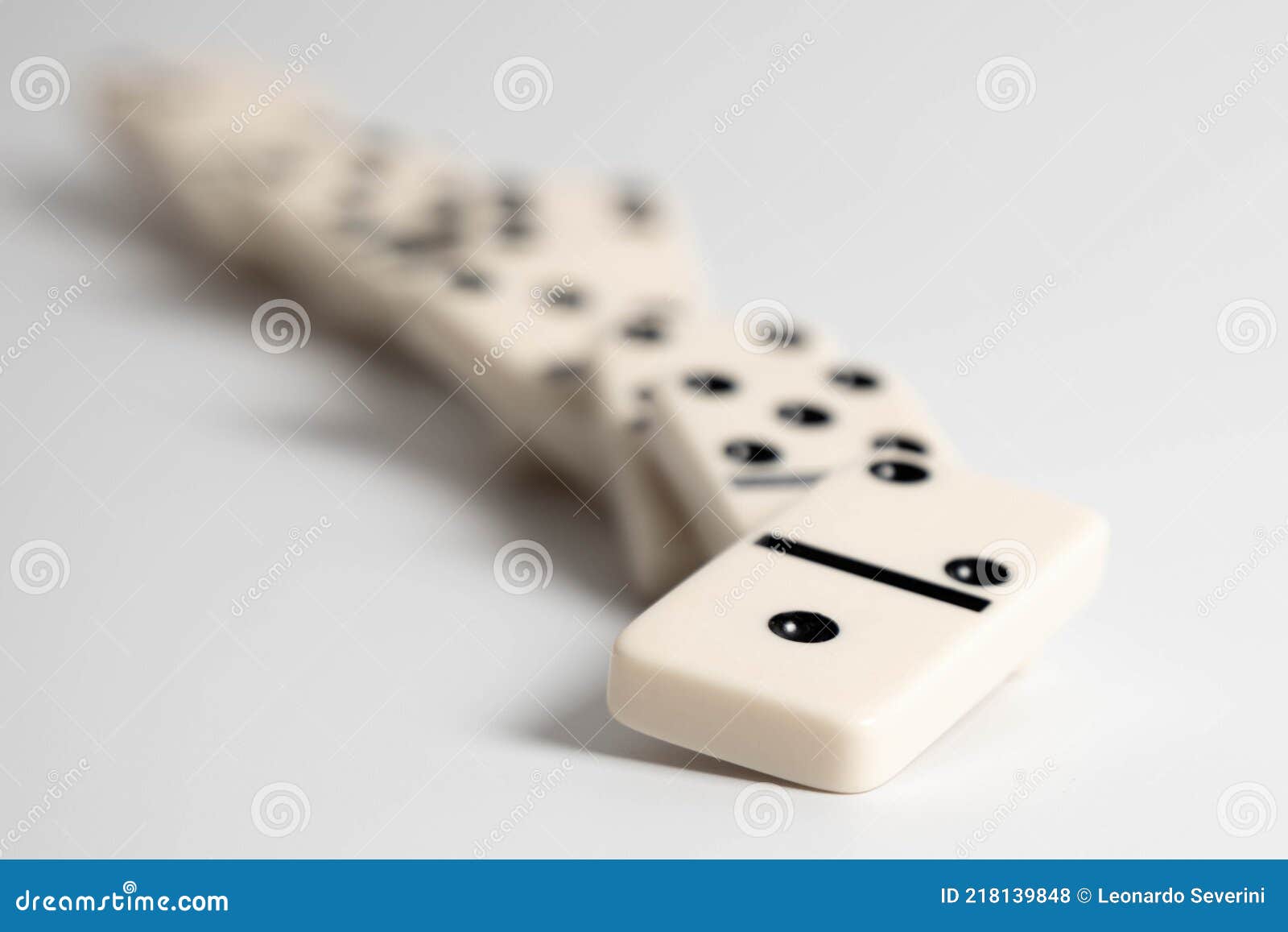 Dominos Falling on a White Background Stock Photo - Image of blue ...