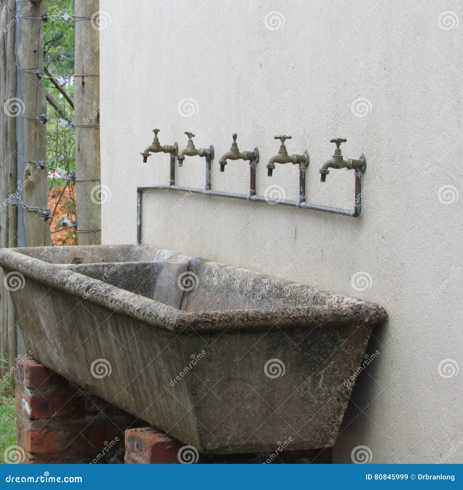 Multiple drinking taps stock image. Image of basin, drinking - 80845999