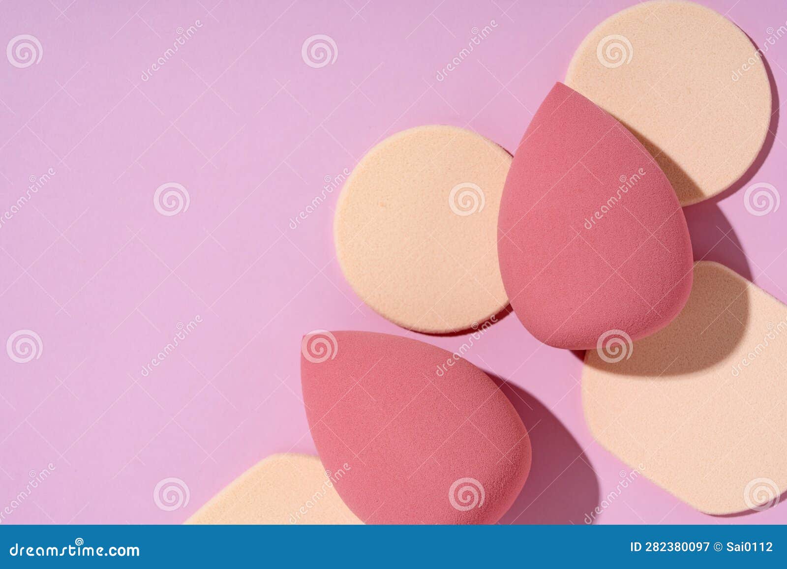 Multiple Egg-shaped Makeup Sponges Placed on a Pink Background Stock ...