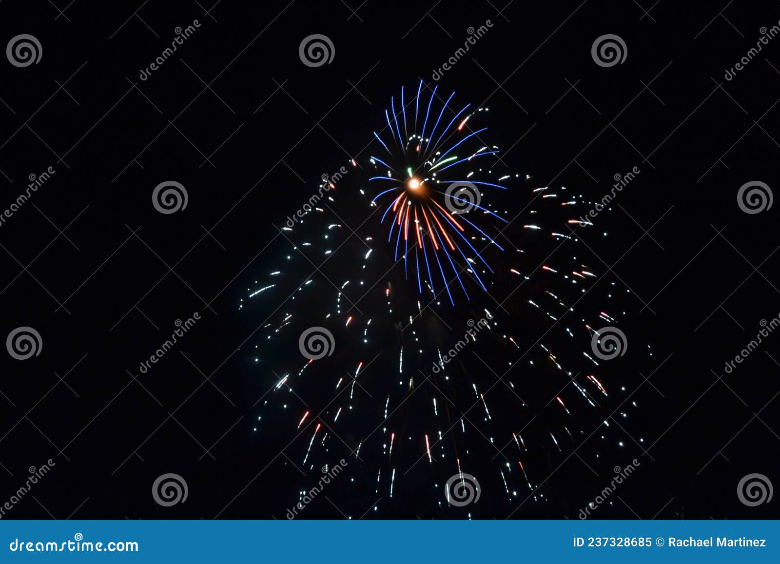Multiple Fireworks Exploding in a Dance of Light Bright Blue Streaks ...