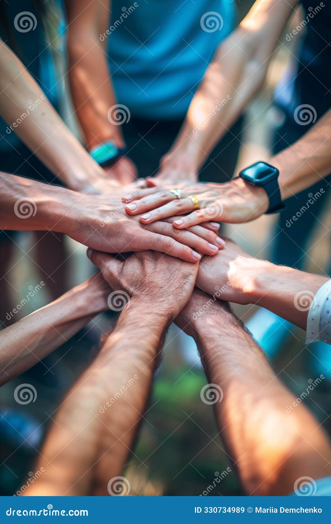 Multiple Hands Stacked Together Symbolizing Teamwork and Unity in ...