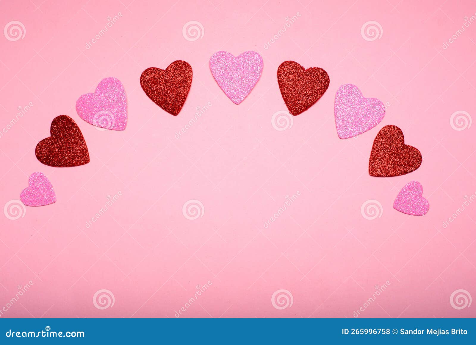 Multiple Hearts with Glitter Forming an Arc on Pink Background. Stock ...