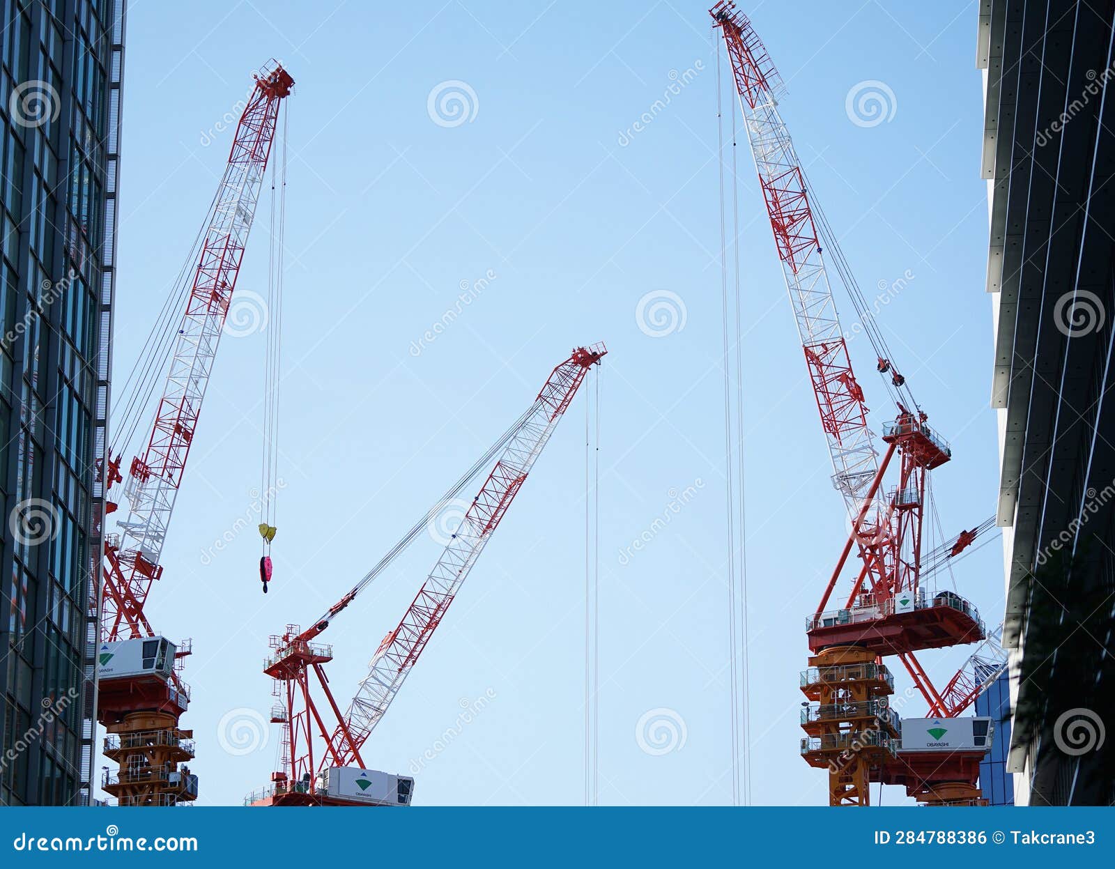 Multiple high-rise cranes editorial photo. Image of transport - 284788386