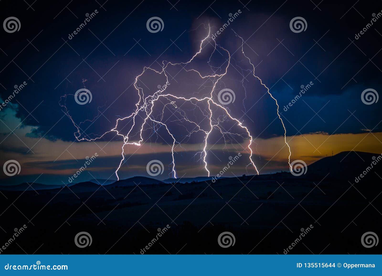 Multiple Lightning Strikes on Distant Mountain Stock Photo - Image of ...