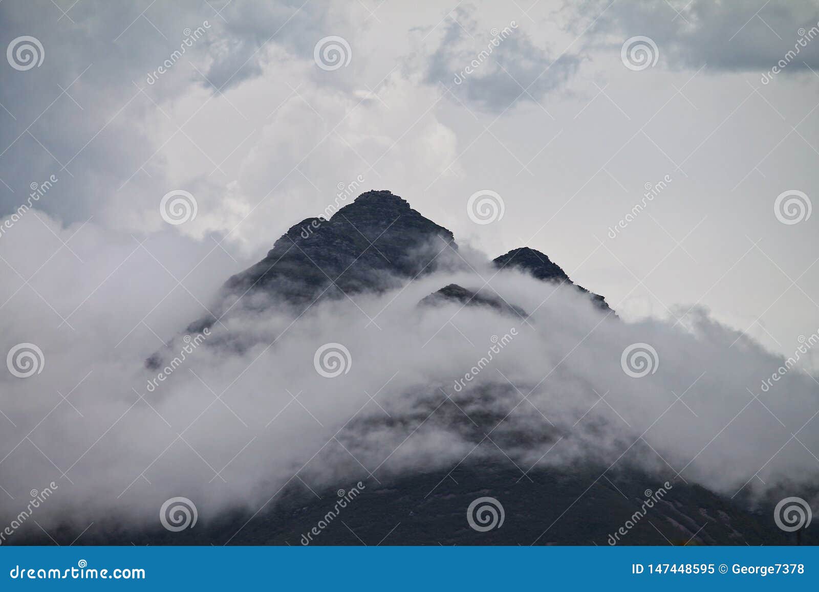 Multiple Mountain Peaks Poking through Clouds Stock Image - Image of ...