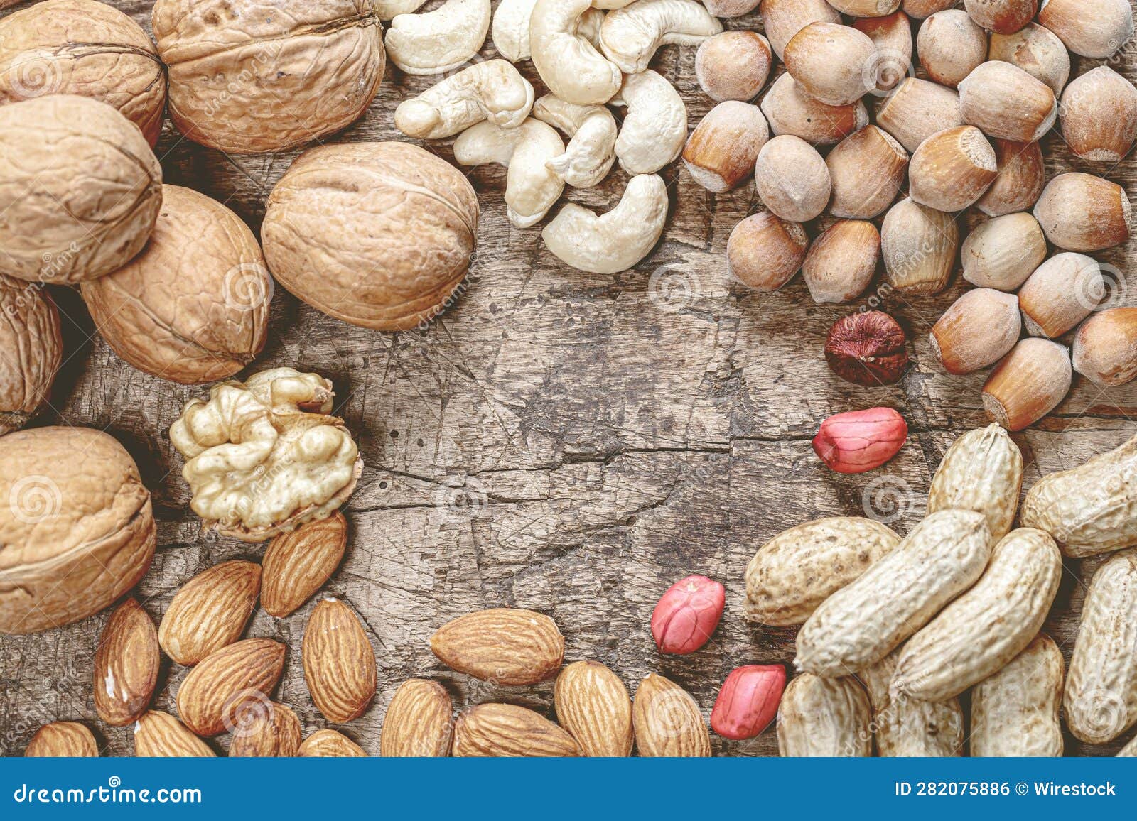 Multiple Nuts on Wooden Board in Different Flavors and Sizes Shown ...