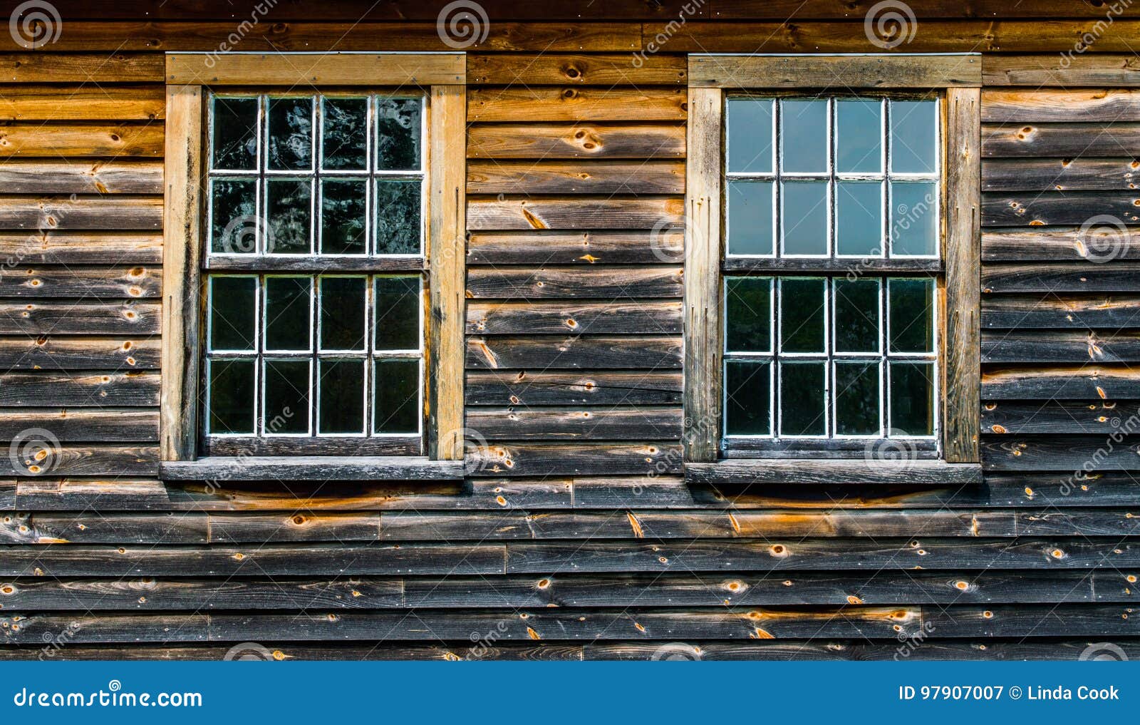 2 Multiple Paned Windows in a Weathered and Charred Wooden Wall Stock ...