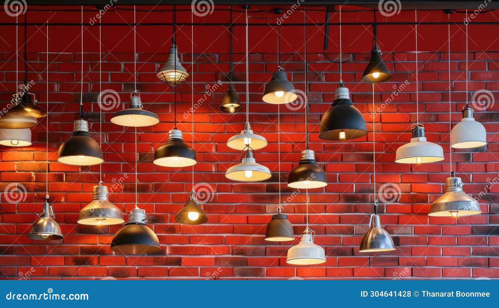 Multiple Pendant Lamps Set Against a Rustic Red Brick Wall for a Chic ...
