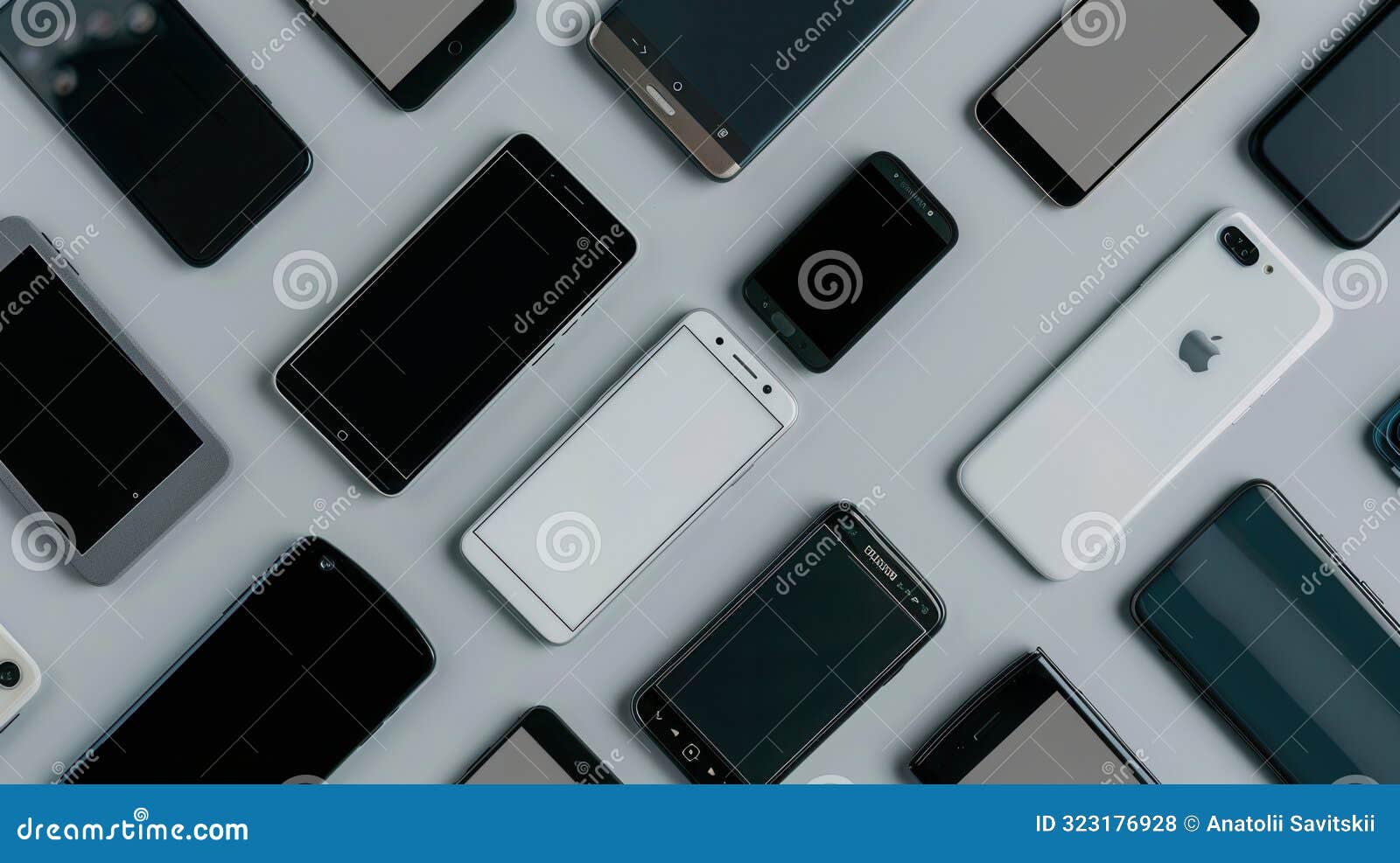 Multiple Smartphones Arranged in a Variety of Angles on a Plain Grey ...