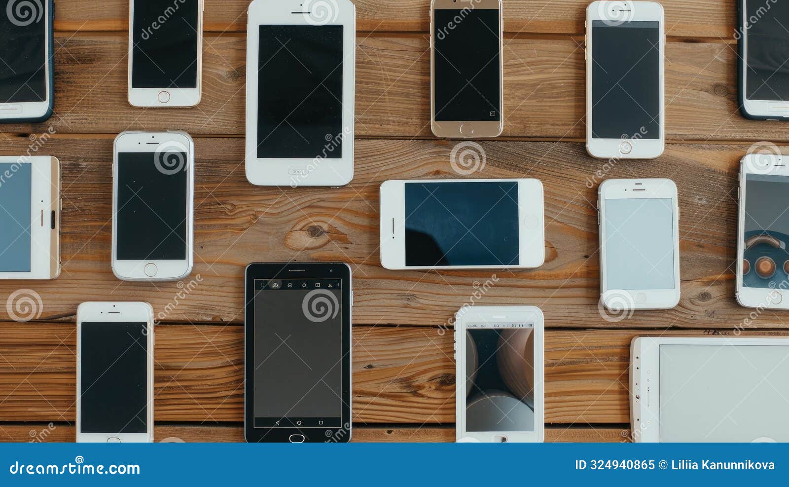 Multiple Smartphones and Tablets are Arranged in Rows on a Woodgrain ...