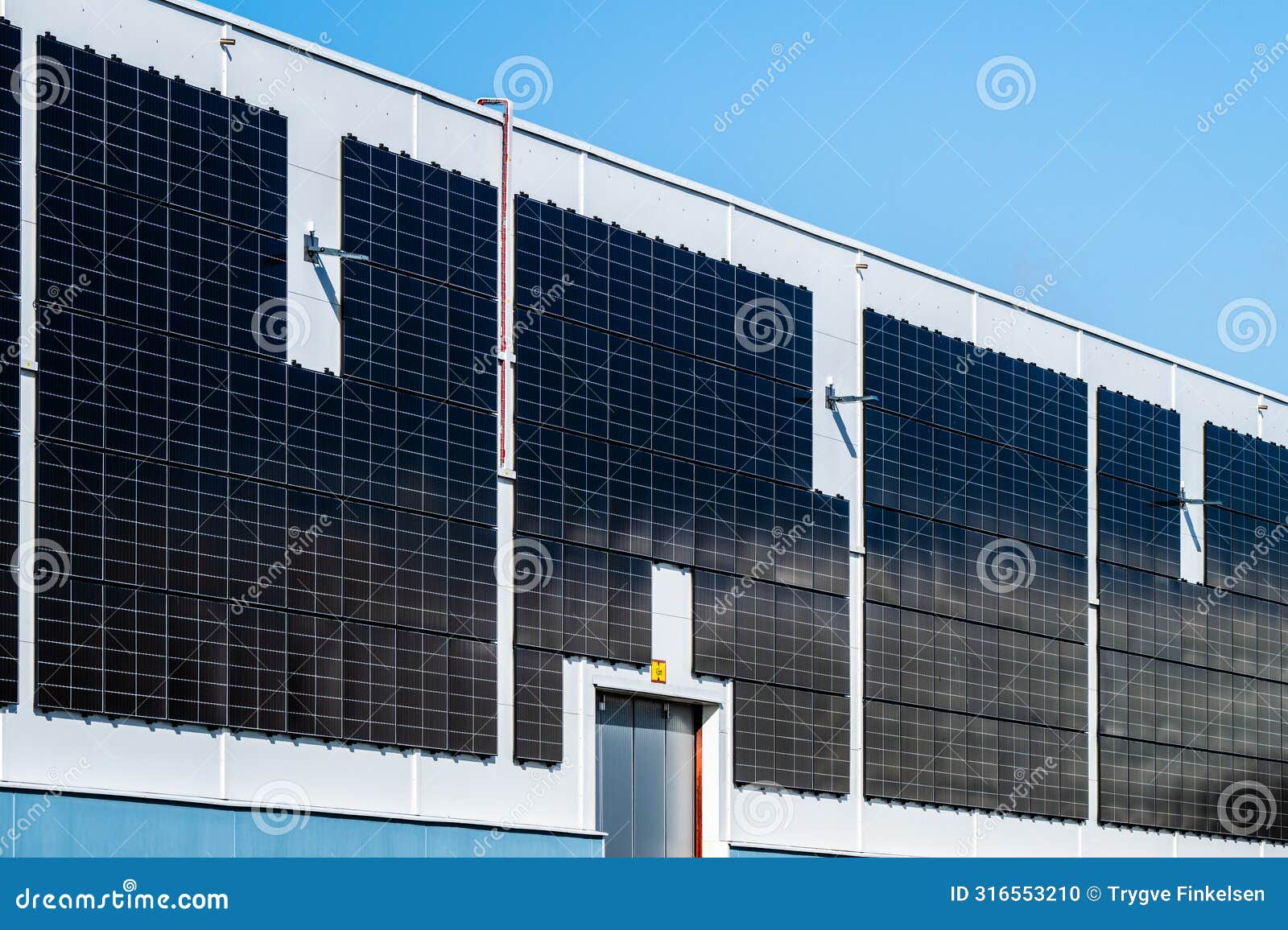 Multiple Solar Panels on a Warehouse Wall.. Stock Photo - Image of ...
