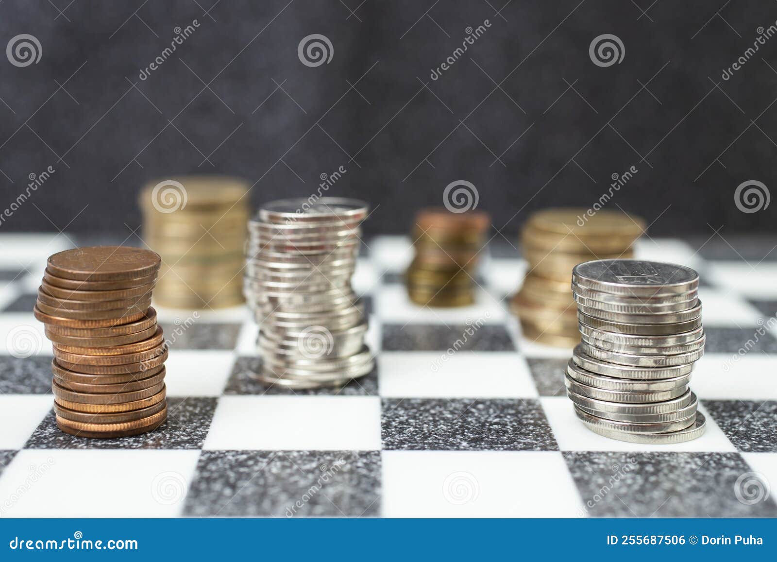 Multiple Stacks of Coins on a Chess Board Stock Photo - Image of game ...