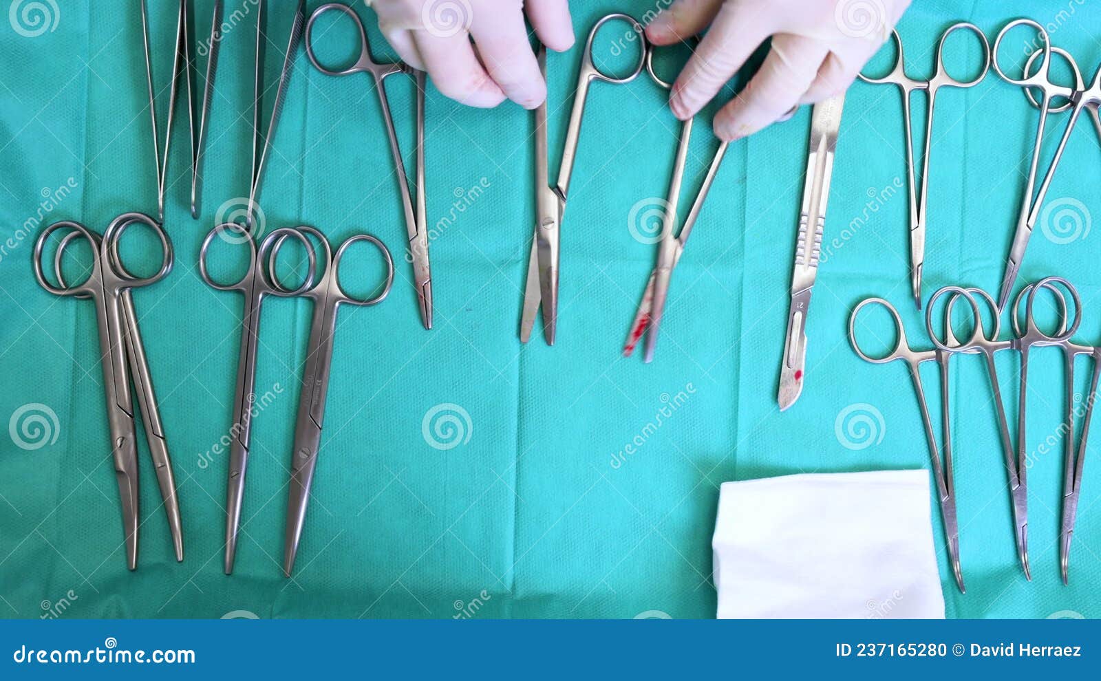 Multiple Surgery Instruments on Blue Table Above View. Surgeon Take ...