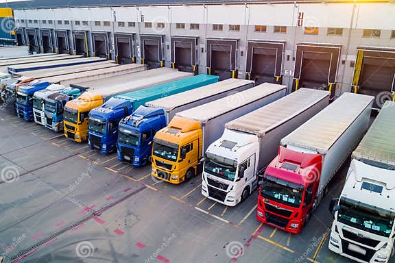 Multiple Trucks Lined Up at a Loading Dock, Ready for Cargo Loading and ...