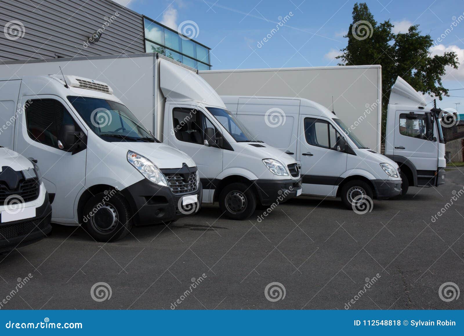 Multiple Trucks Park in a Large Parking Stock Photo - Image of front ...