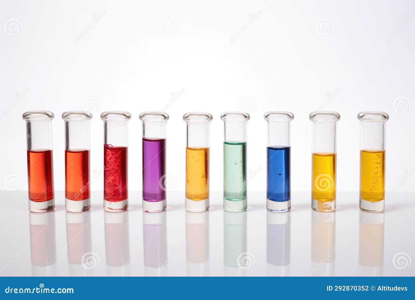 Multiple Vials with a Colorful Liquid Setup Diagonally Across a White ...