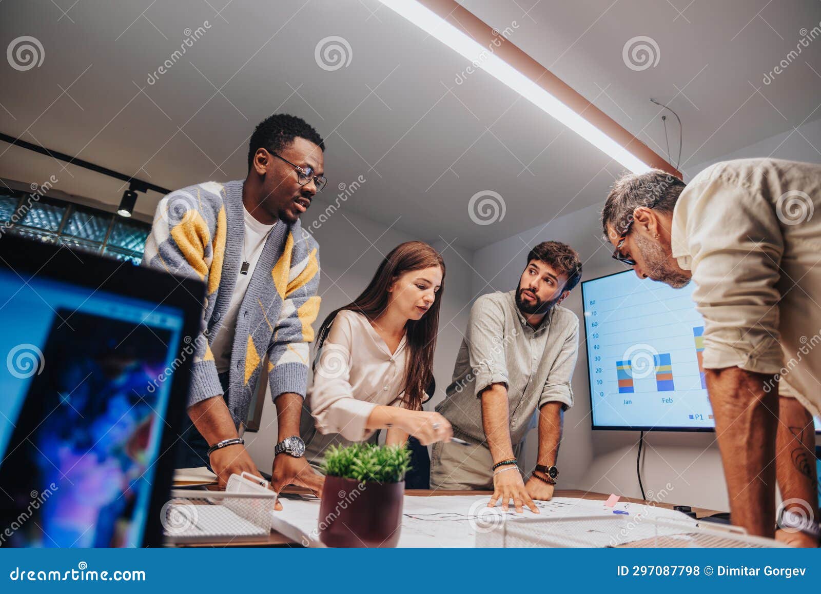 Multiracial Team of Architects and Engineers Collaborating on Project ...