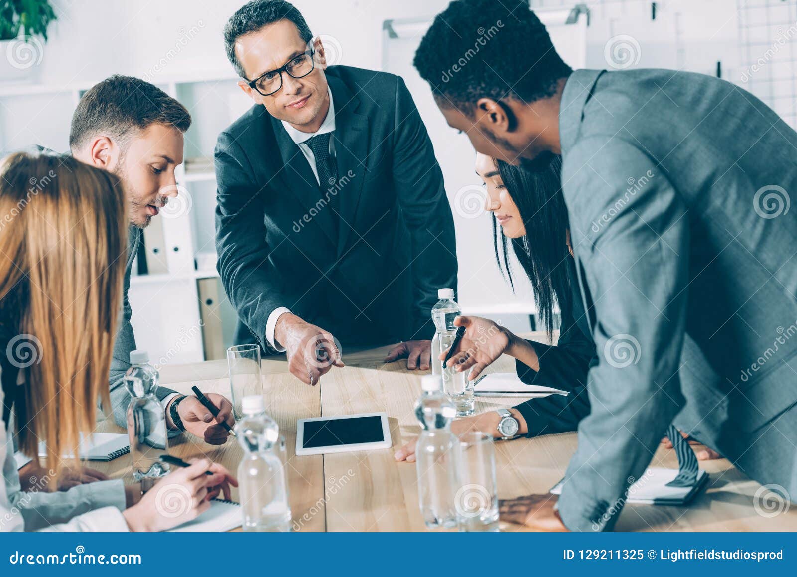 Multiracial Businesspeople Having Conversation in Conference Hall and ... Multiracial Businesspeople Having Conversation in Conference Hall and ...