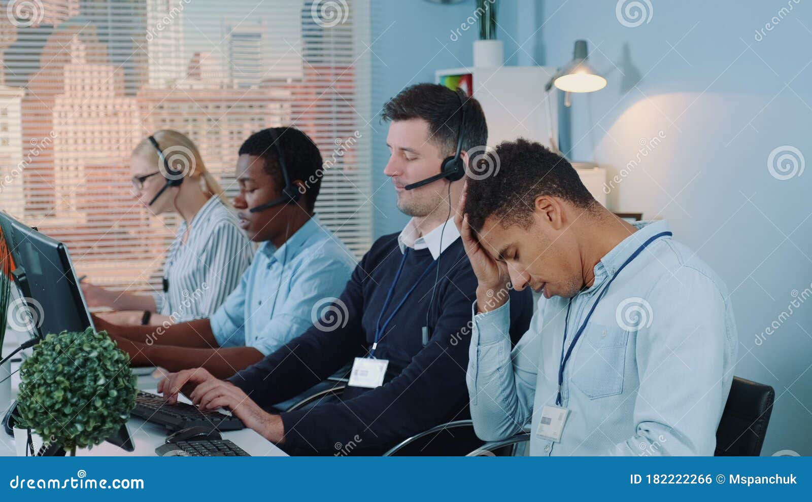 Multiracial Call Center Agent Feeling Exhausted and Broken-down after ...