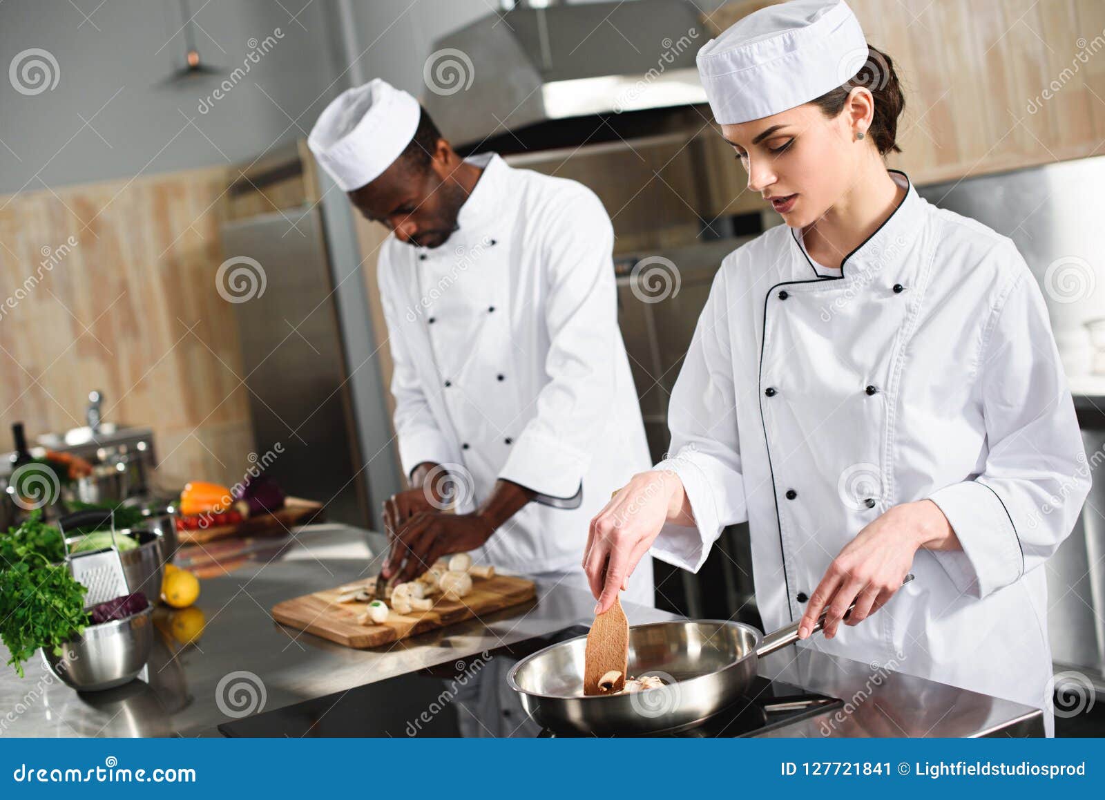 Multiracial Chefs Team Man and Woman Cooking Stock Image - Image of ...