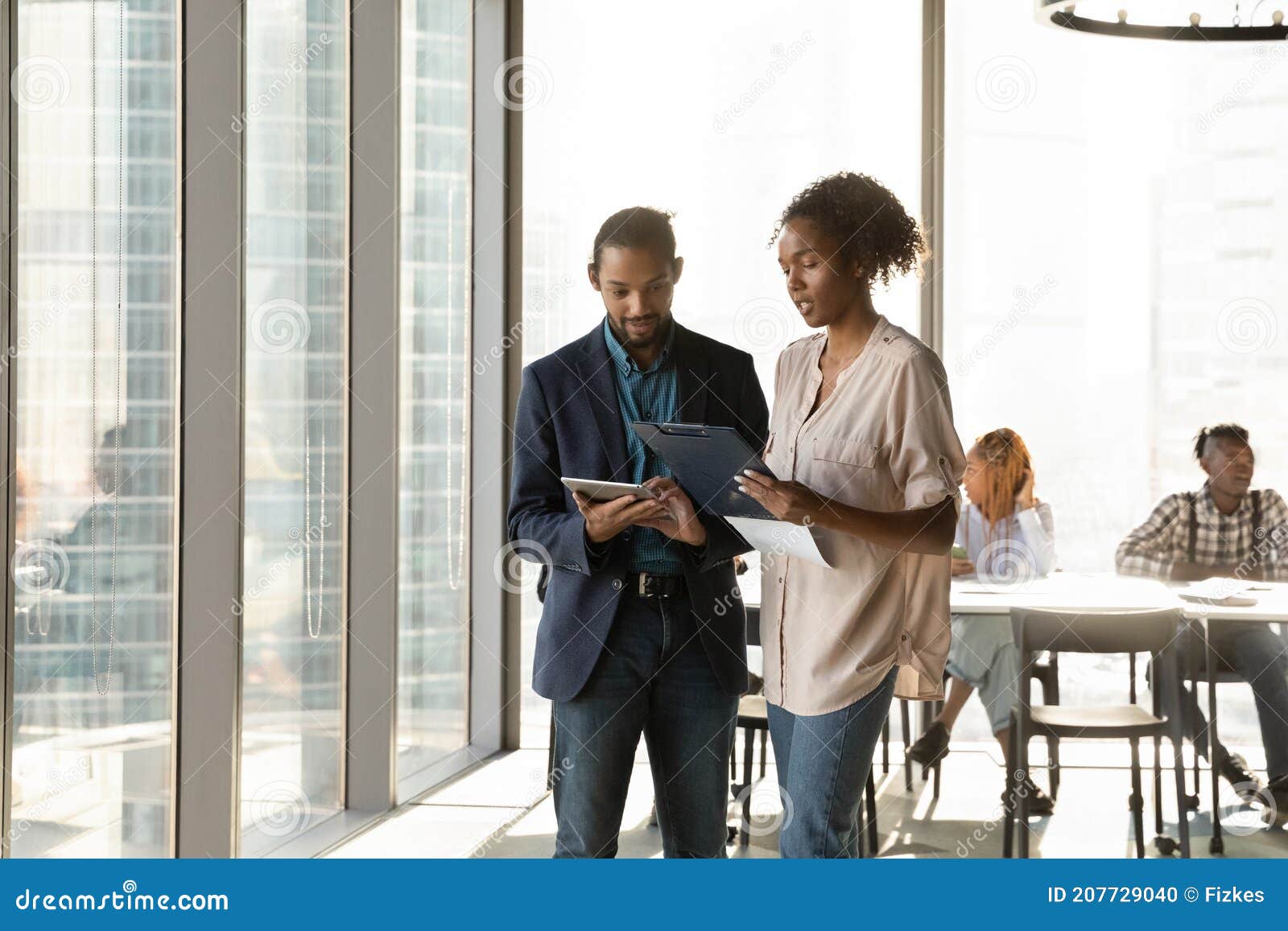 Multiracial Colleagues Cooperate Discussing Ideas at Office Stock Photo ...