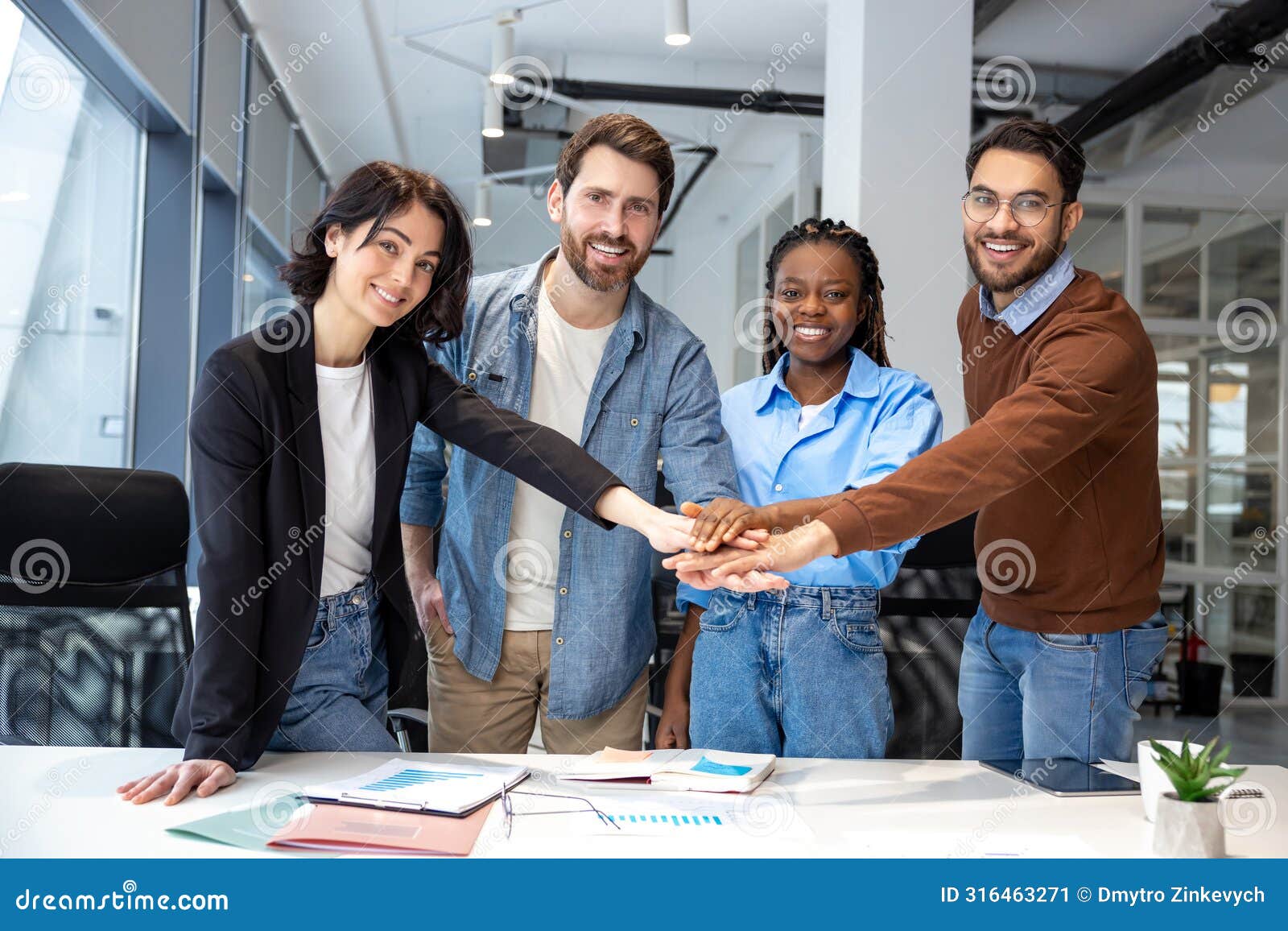 Multiracial Colleagues Involved in Team Building Activity Staff ...