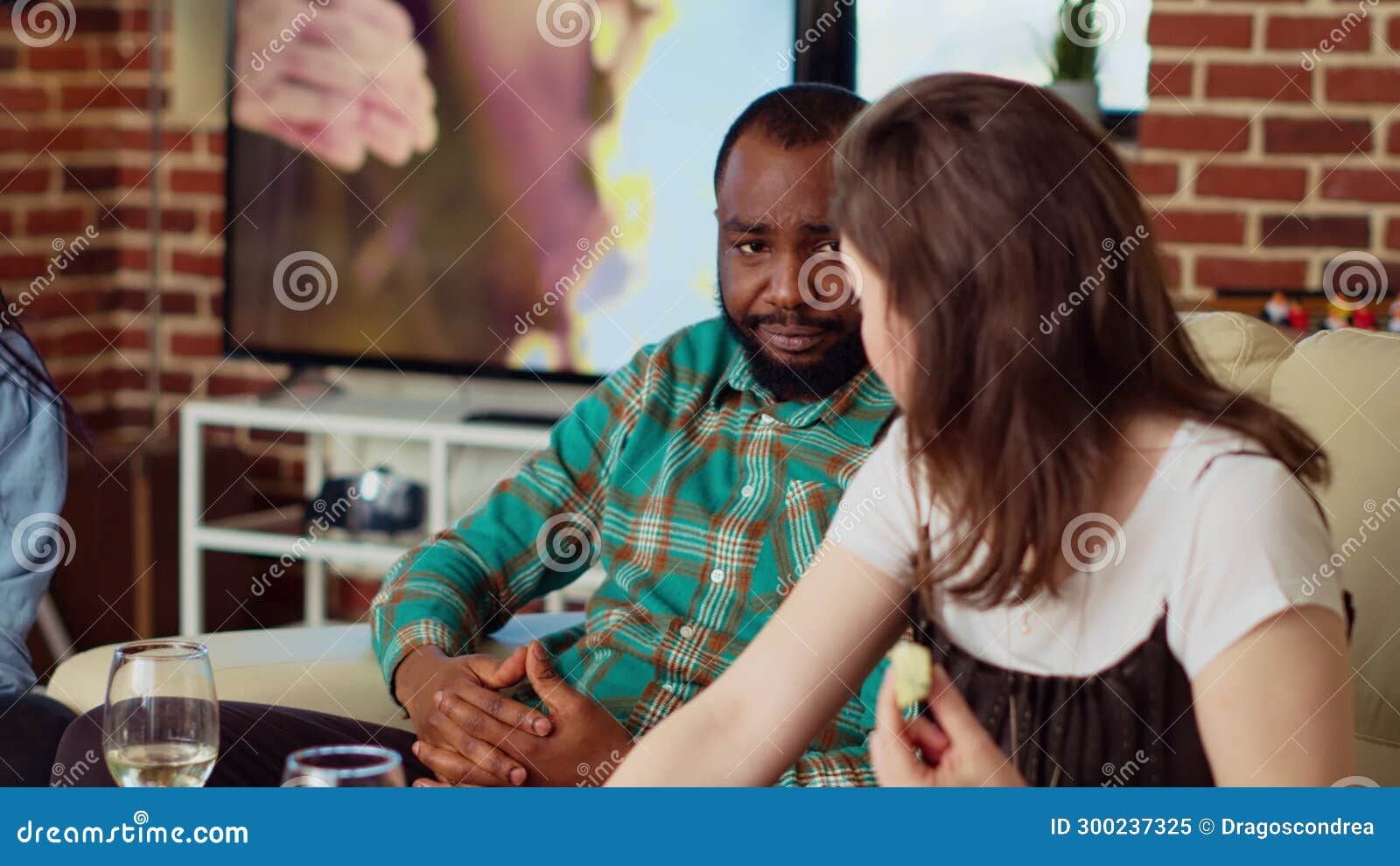 Multiracial Couple Invited At Friends Birthday Talking And Drinking