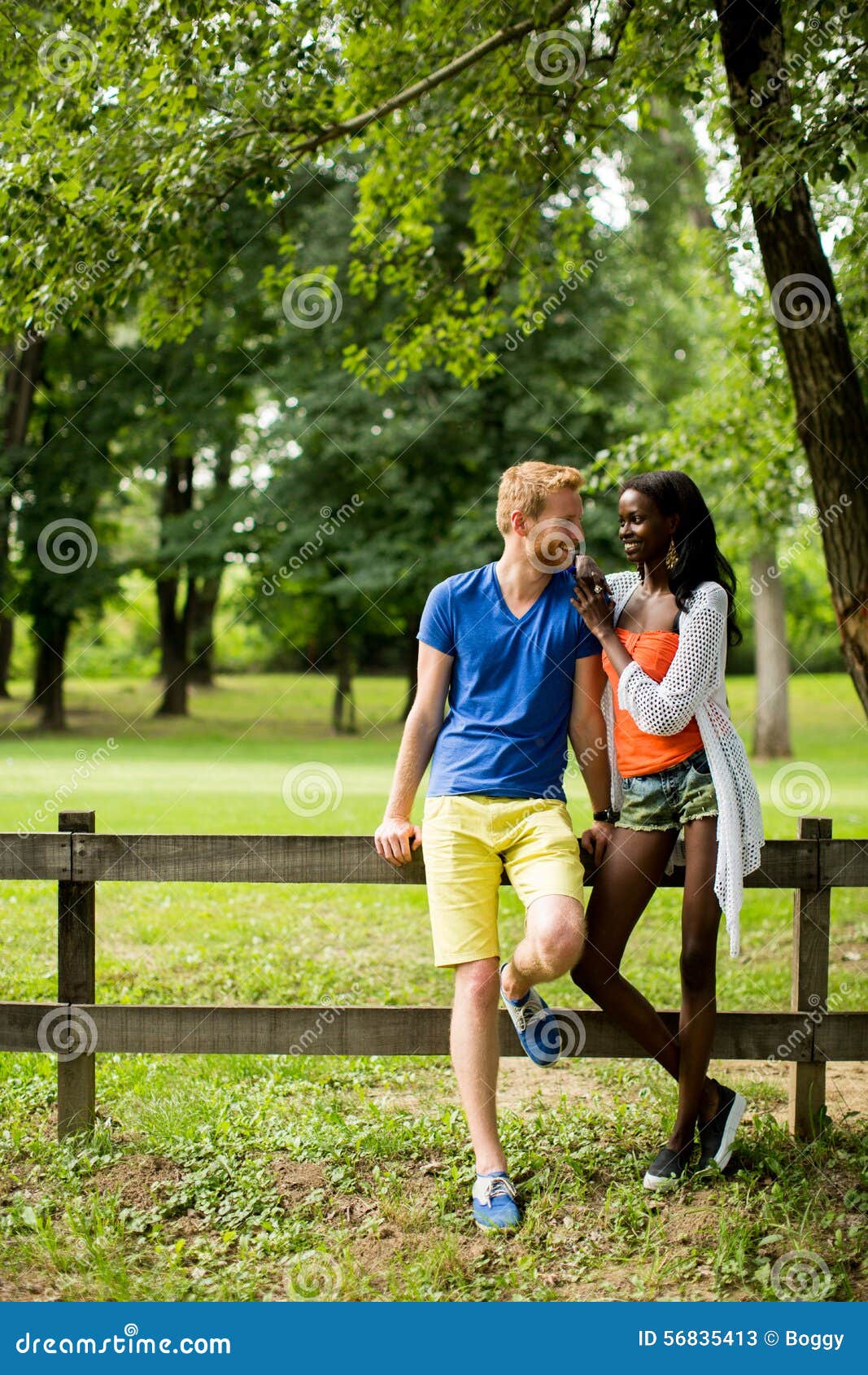 Multiracial Couple in the Park Stock Image - Image of casual, sitting ...