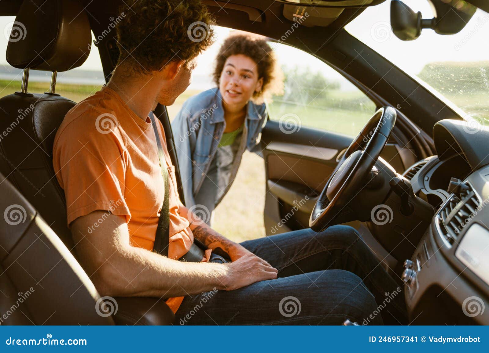 Multiracial Couple Talking and Looking at Each Other during Car Trip ...