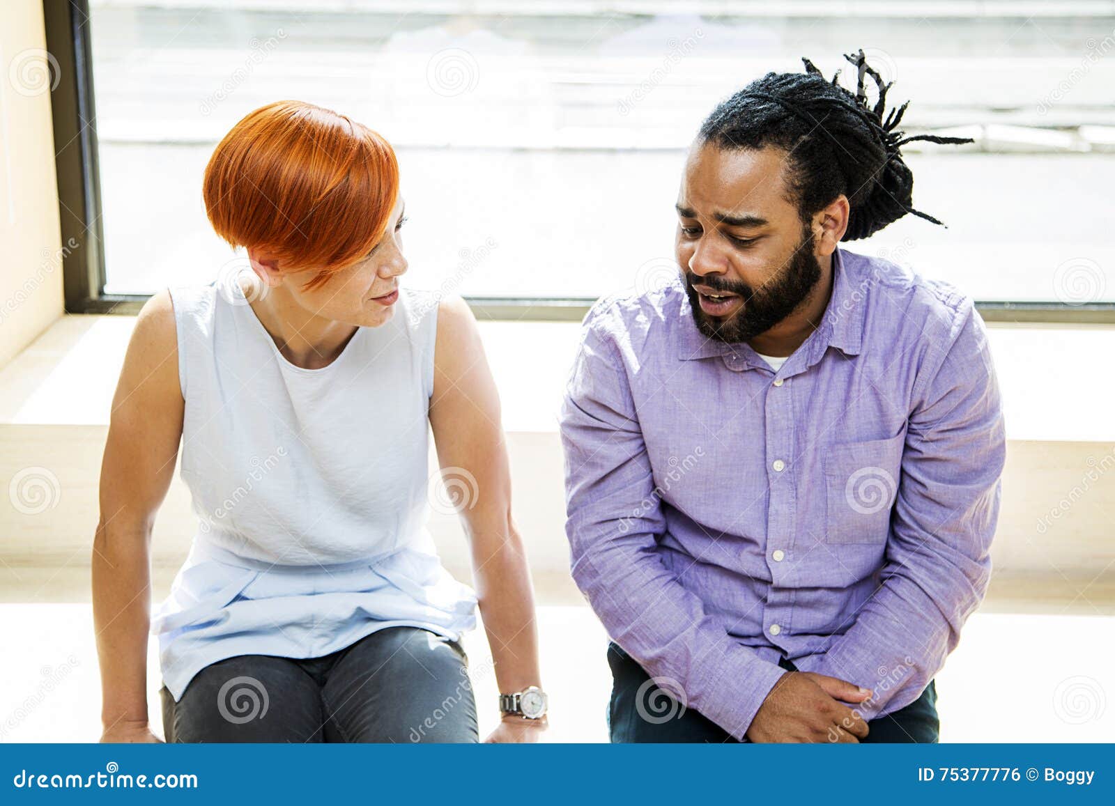 Multiracial couple talking stock photo. Image of young - 75377776