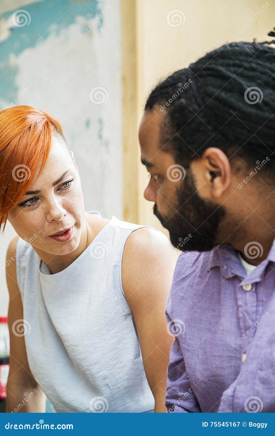 Multiracial couple talking stock image. Image of girl - 75545167