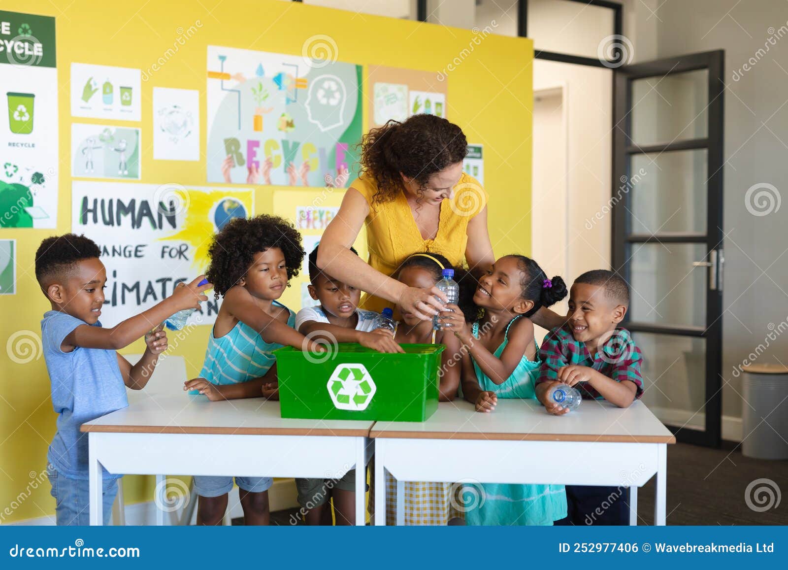 Multiracial Elementary Students and Young Female Teacher Collecting ...