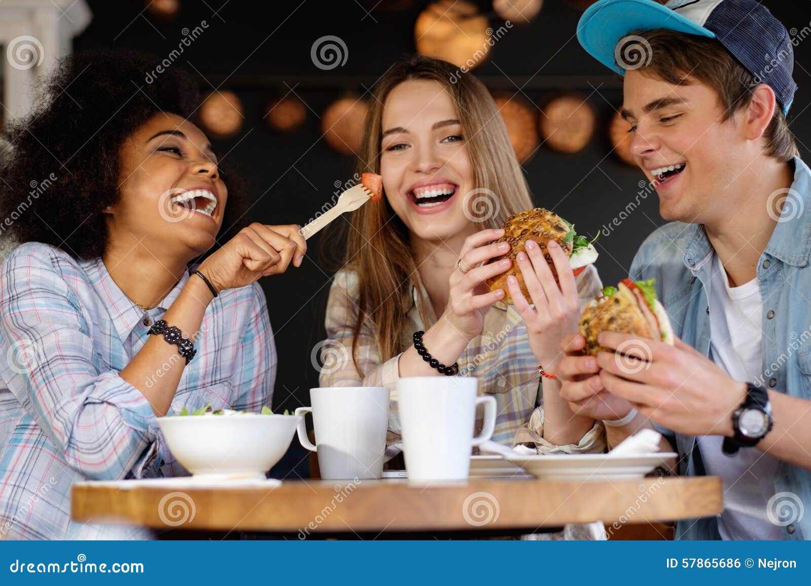 Multiracial Friends Eating in a Cafe Stock Photo - Image of food ...