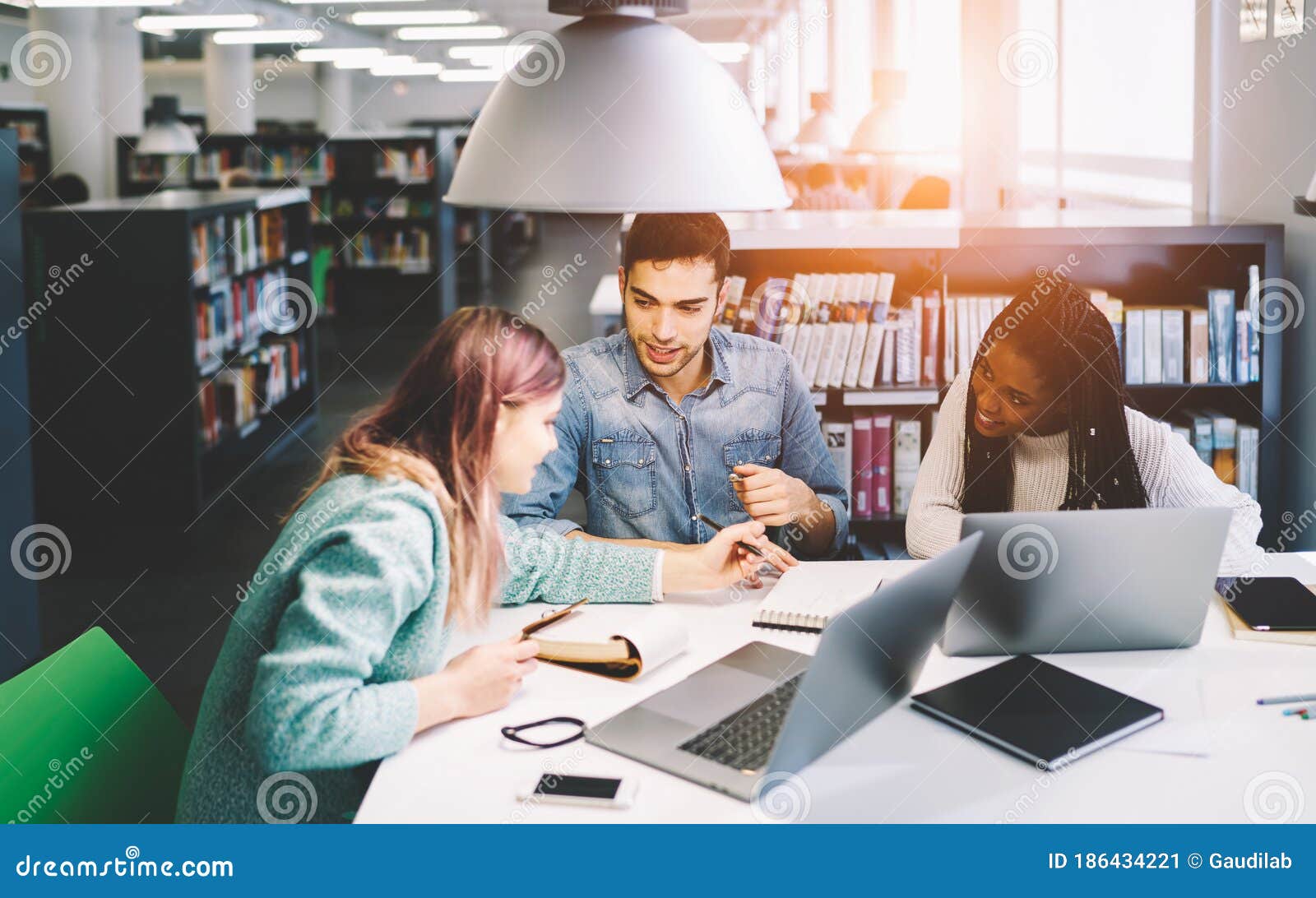 Multiracial Group of International Students Collaborating Working on ...