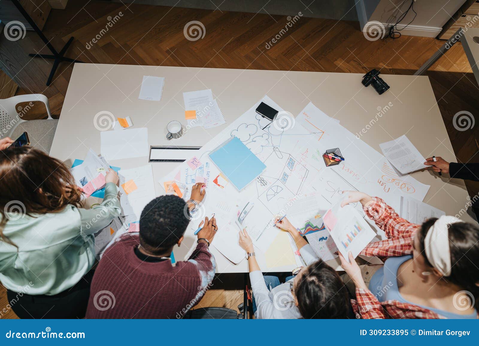 Multiracial Group of People Engaging in a Brainstorming Session with ...