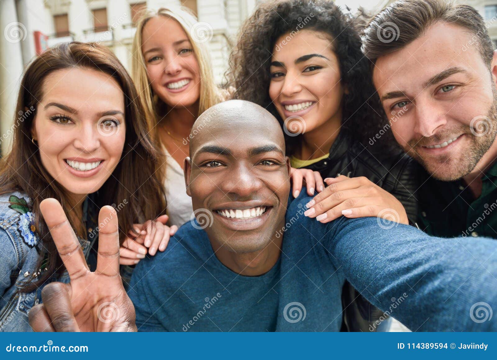 Multiracial Group Of Friends From Five Young Women Walks On City Street ... Multiracial Group Of Friends From Five Young Women Walks On City Street ...